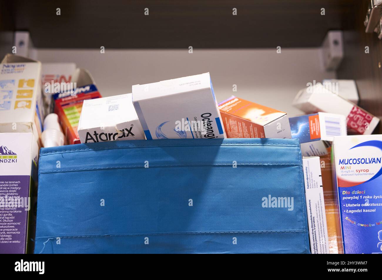 Blue container filled with medicine and diet supplements Stock Photo ...
