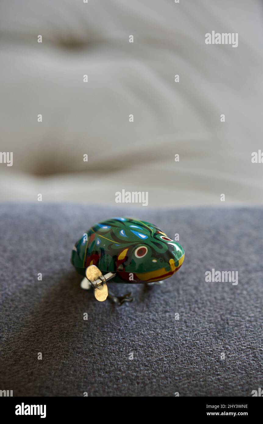 Vertical shot of clockwork frog on the grey background Stock Photo - Alamy