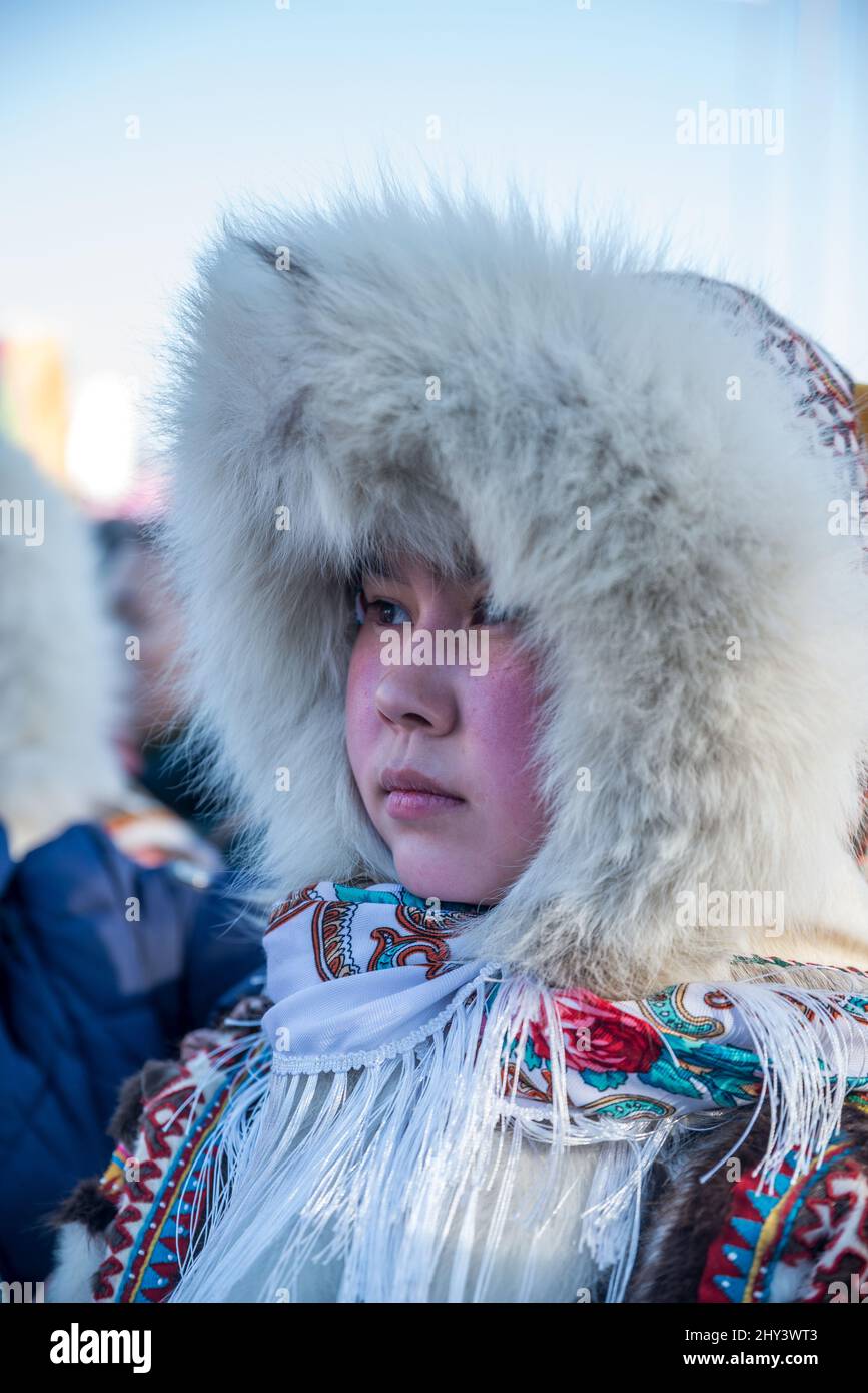 Young Nenet woman in traditional reindeer fur clothes at Reindeer ...