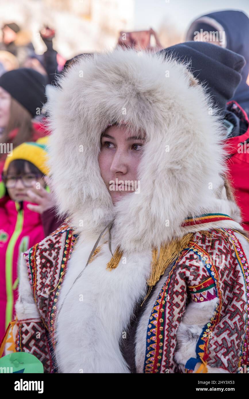 Young Nenet woman in traditional reindeer fur clothes at Reindeer ...