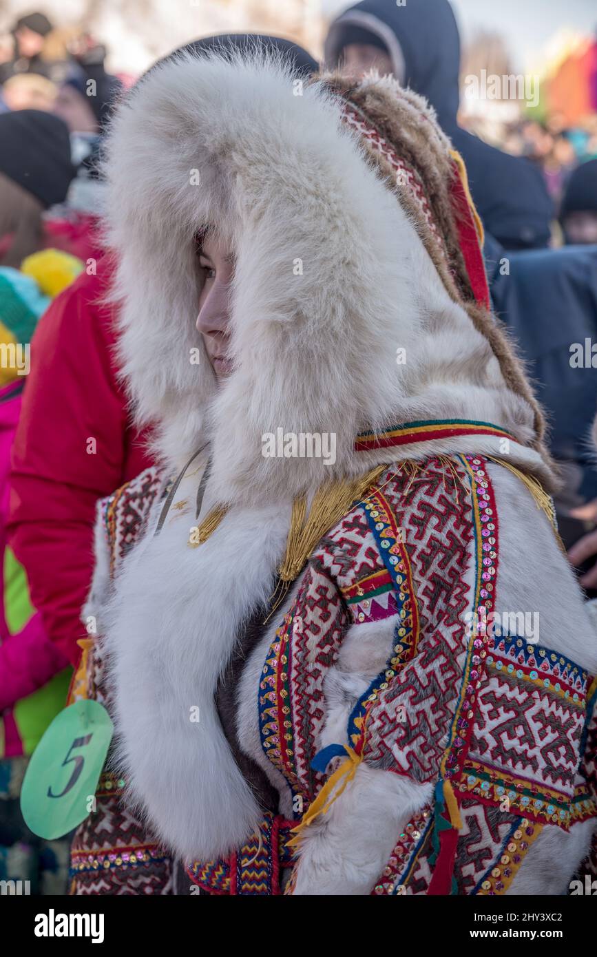 Young Nenet woman in traditional reindeer fur clothes at Reindeer ...