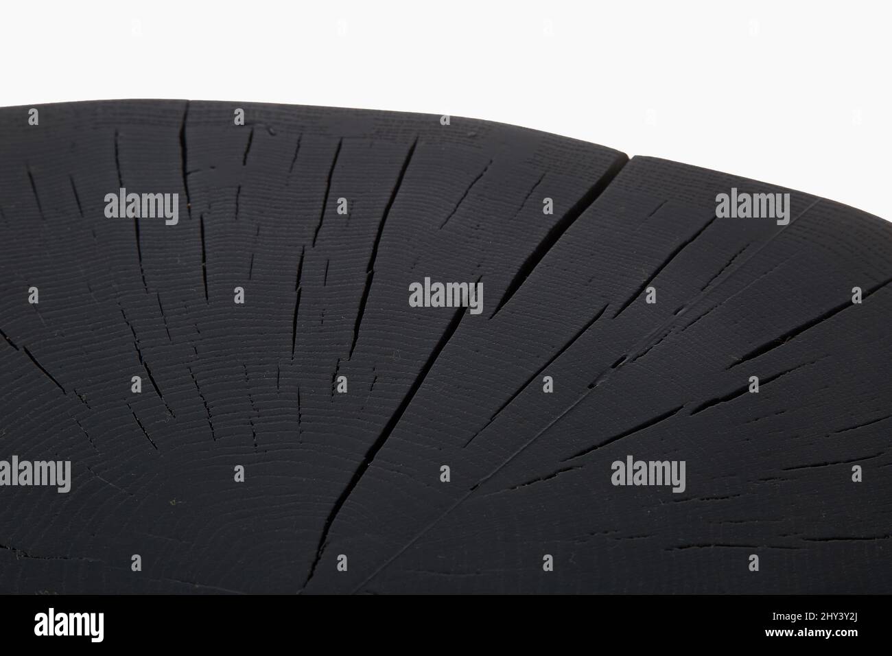 Close-up shot of the top of three legged black stool isolated on a ...