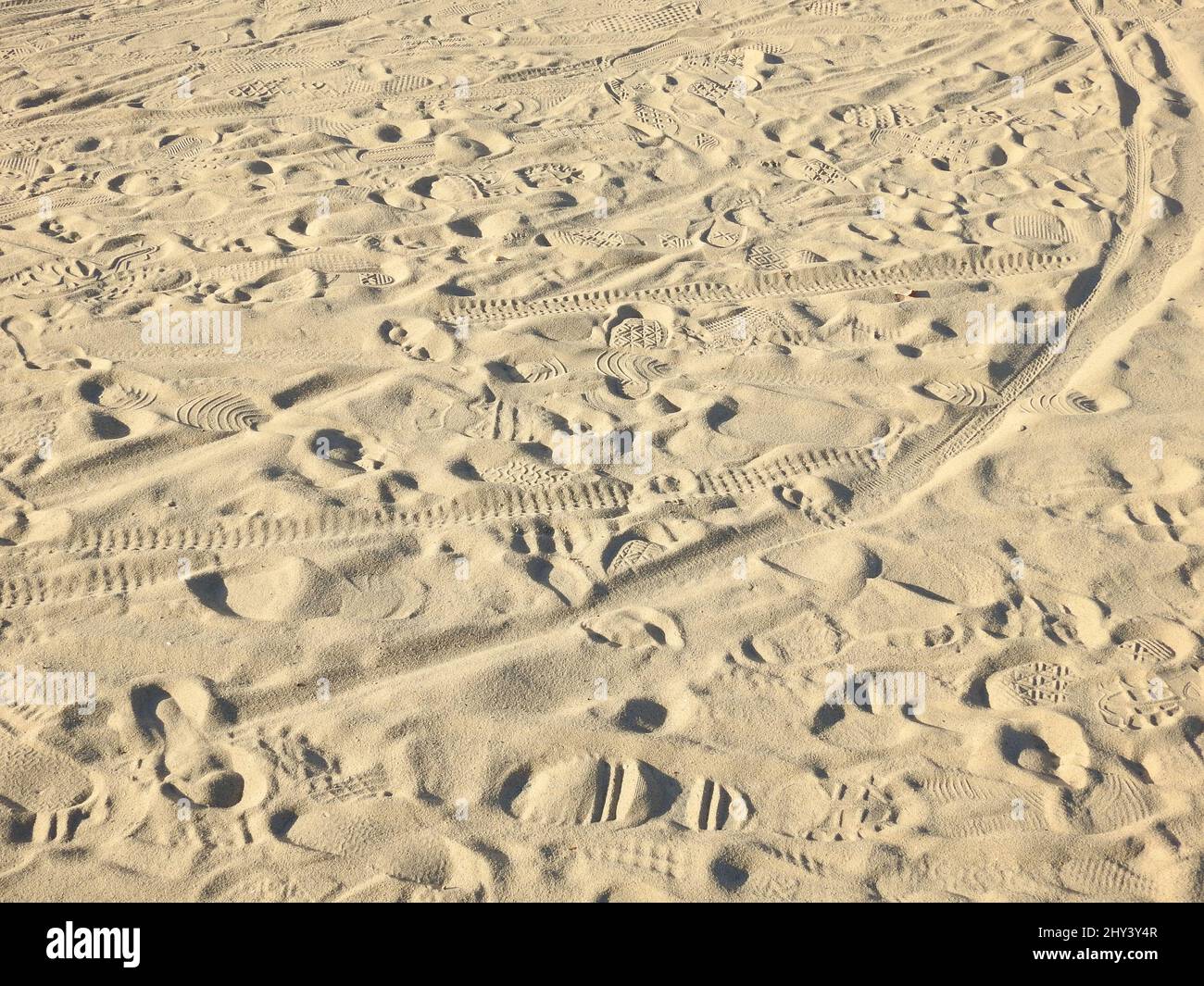 Sand texture with footprints Stock Photo - Alamy