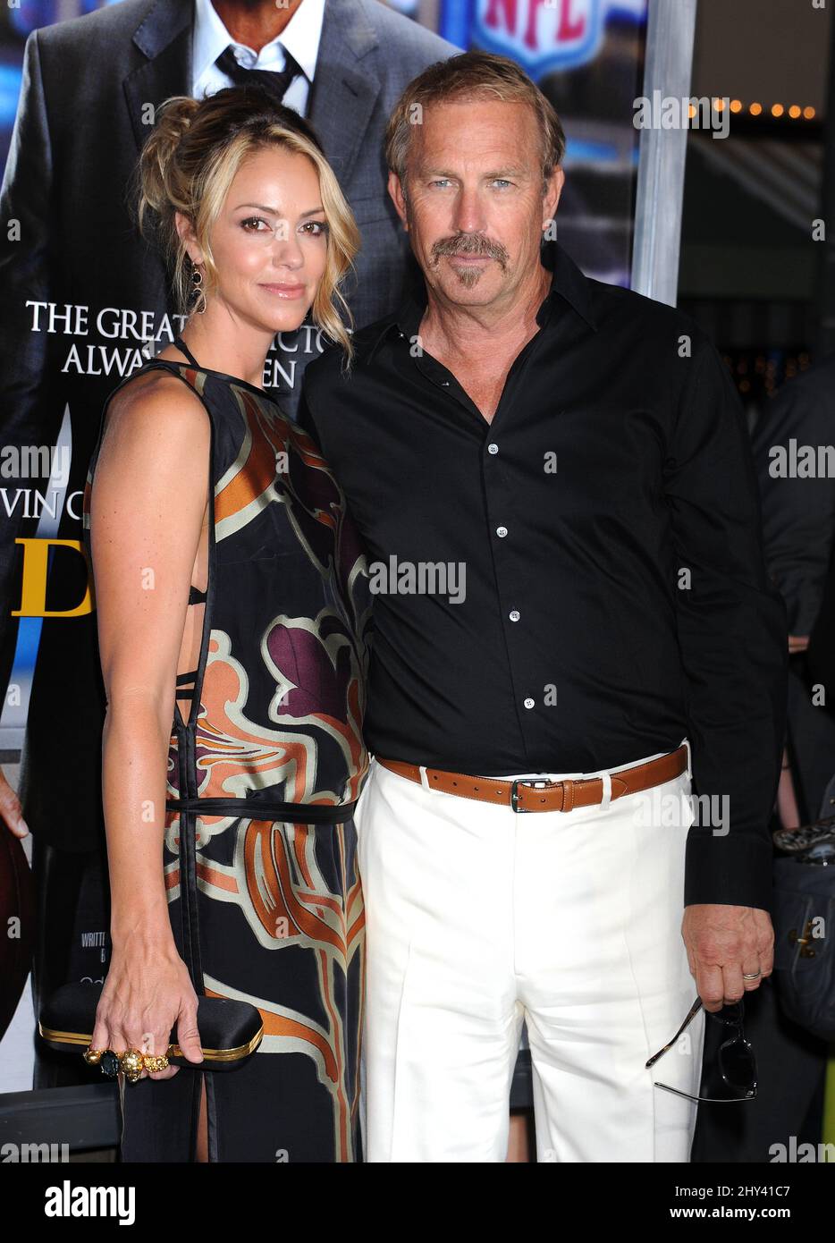 Kevin Costner and Christine Baumgarten attending the premiere of 'Draft ...