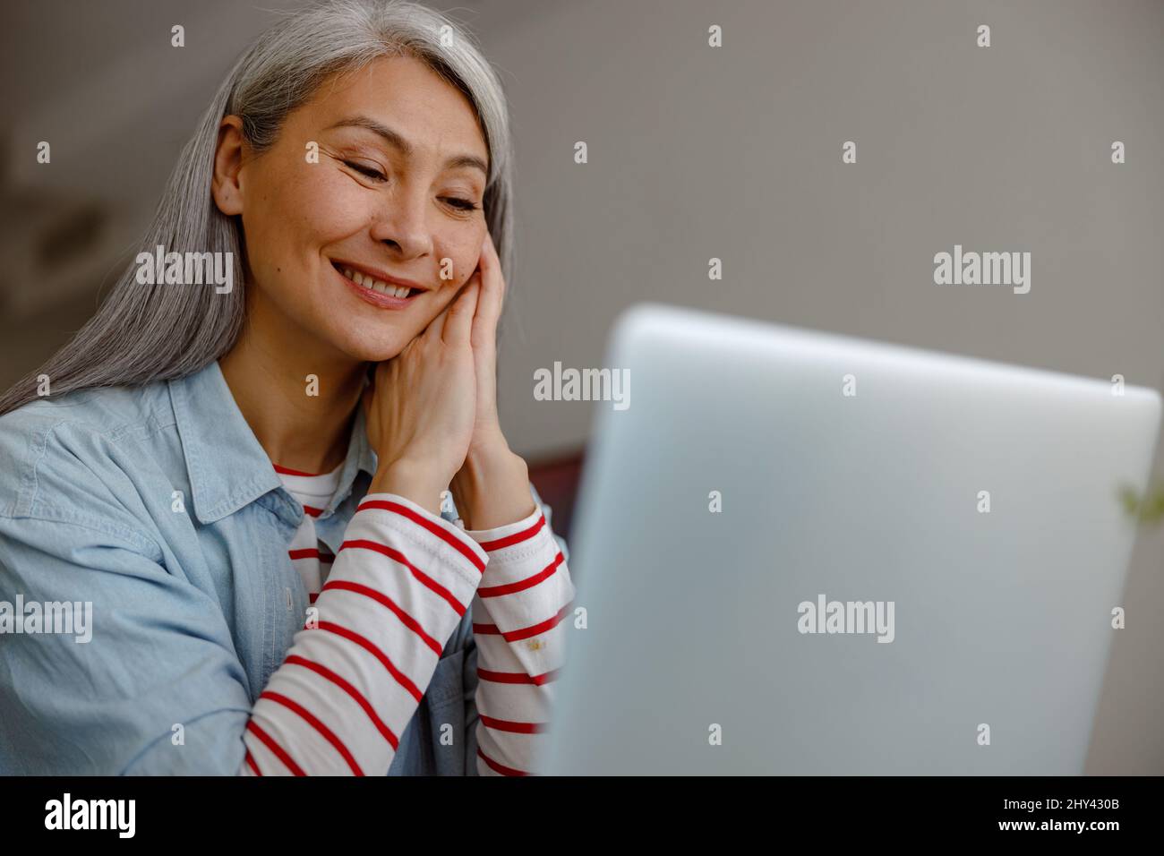 Positive woman watching video on hi-res stock photography and images ...