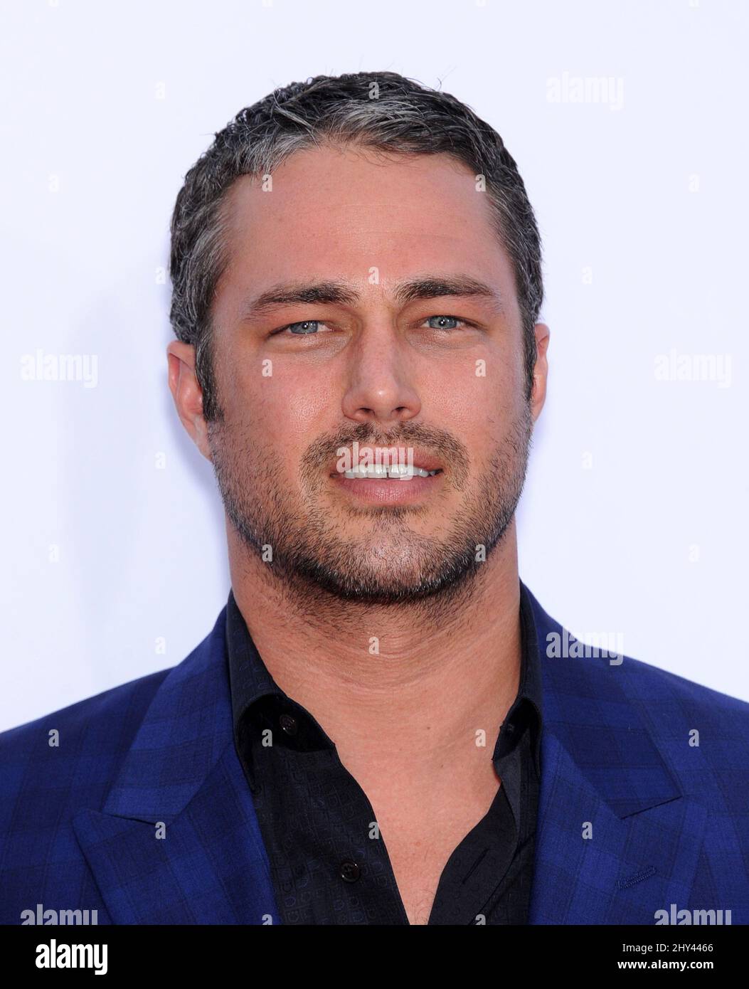 Taylor Kinney arriving for the premiere of The Other Woman held at the ...