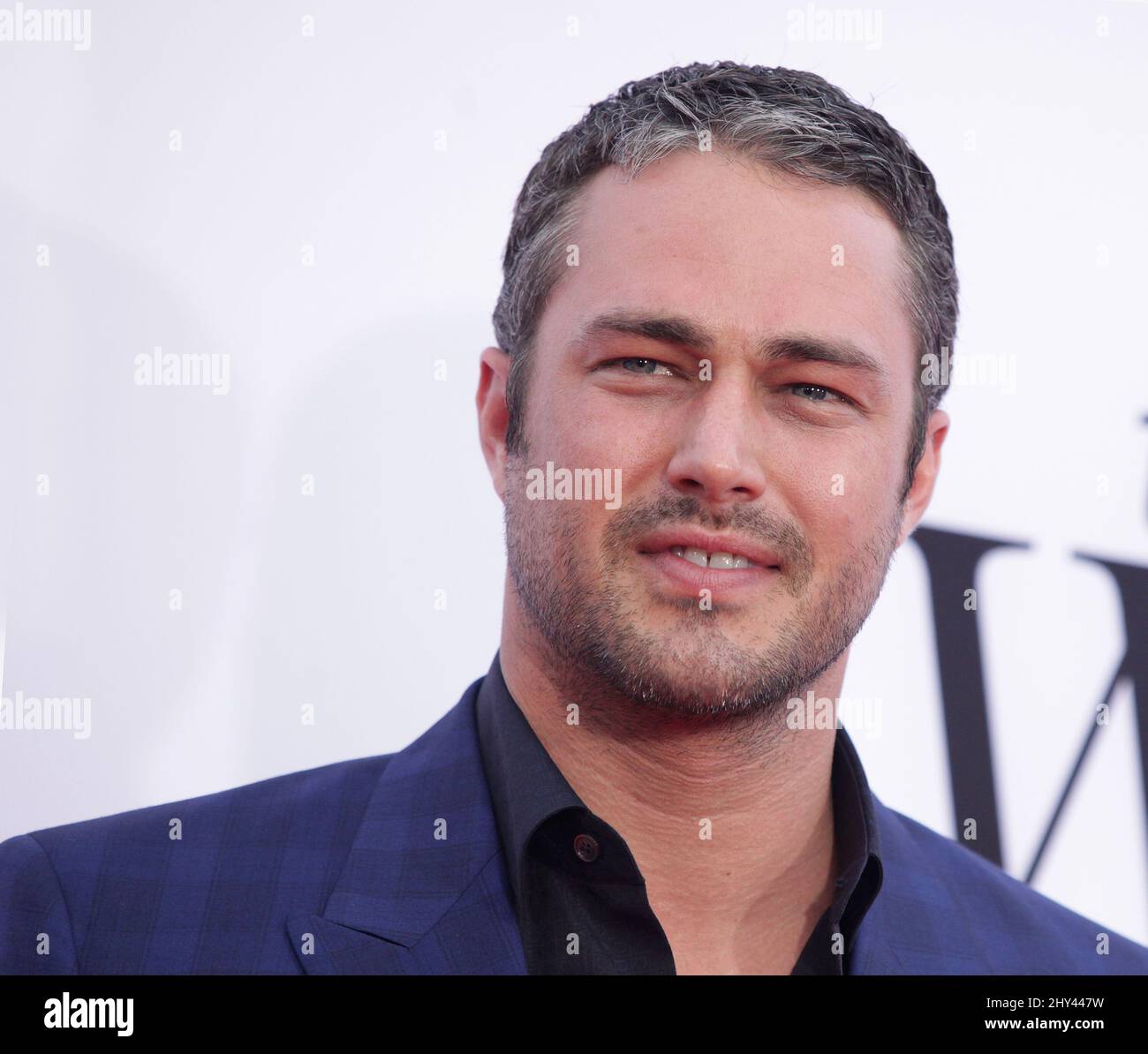 Taylor Kinney arriving for the premiere of The Other Woman held at the ...