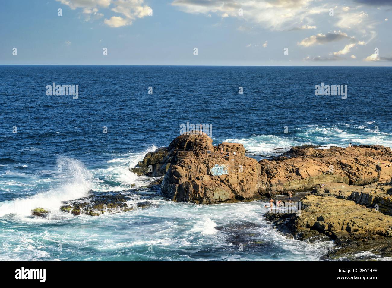 Rocky beach of Ahtopol under a blue cloudy sky on a sunny day Stock ...