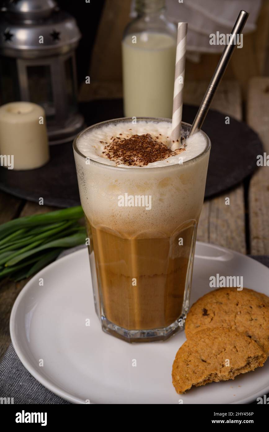 Iced coffee with cookies on a decorated table Stock Photo - Alamy