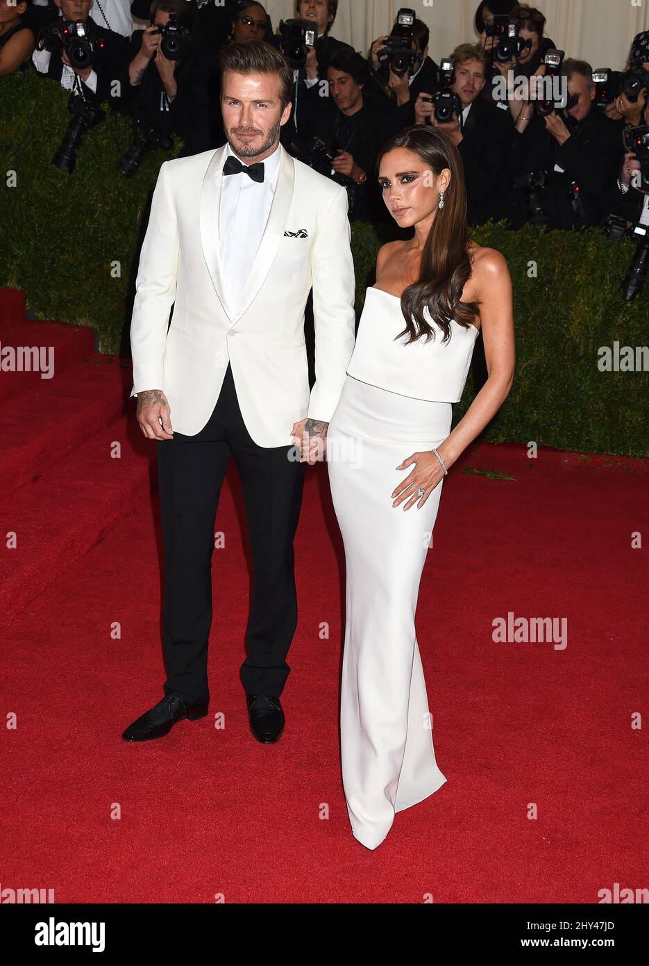 David Beckham & Victoria Beckham arriving at the Costume Institute ...