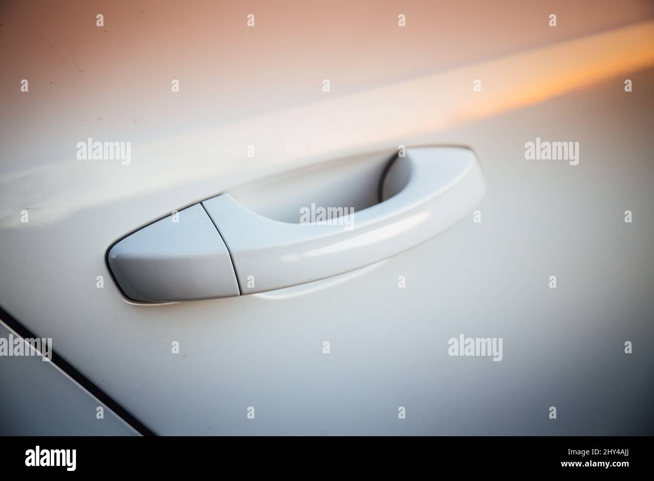 Close up photo of a handle of a white car door Stock Photo - Alamy
