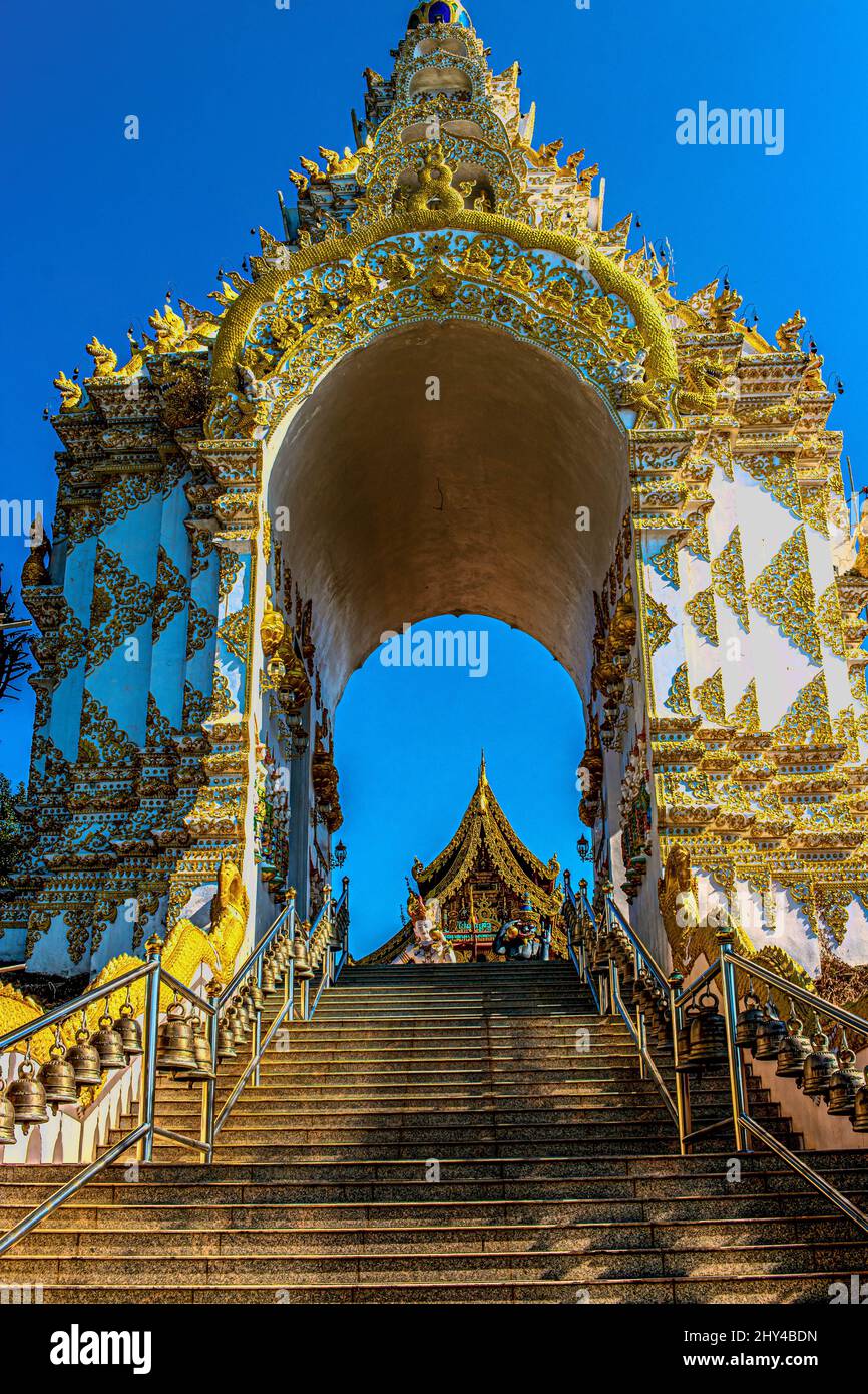 Golden arch over a long stairs in the Buddhist temple in Thailand Stock ...