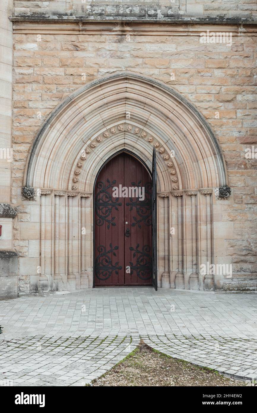 Vertical shot of an old wooden door of the castle Stock Photo - Alamy