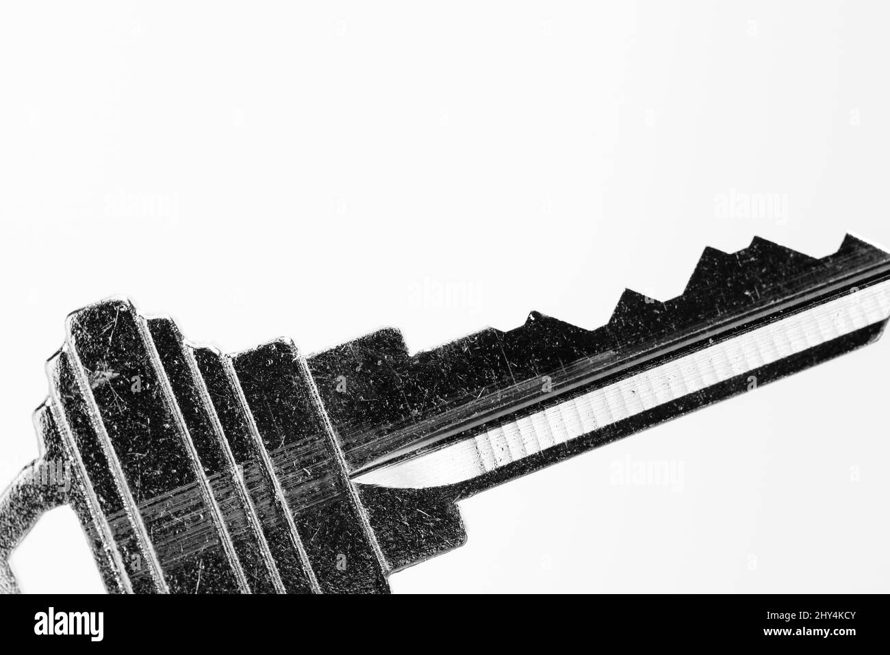 Grayscale closeup of a metal key isolated on a white background Stock ...