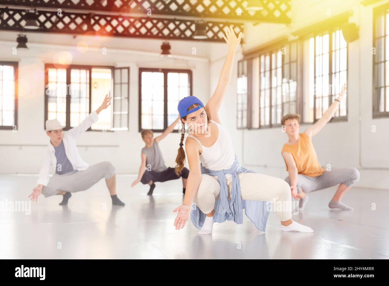 Team of young dancers training moves Stock Photo - Alamy