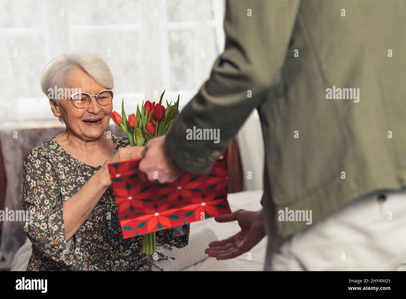 Senior lady receiving package hi-res stock photography and images - Alamy