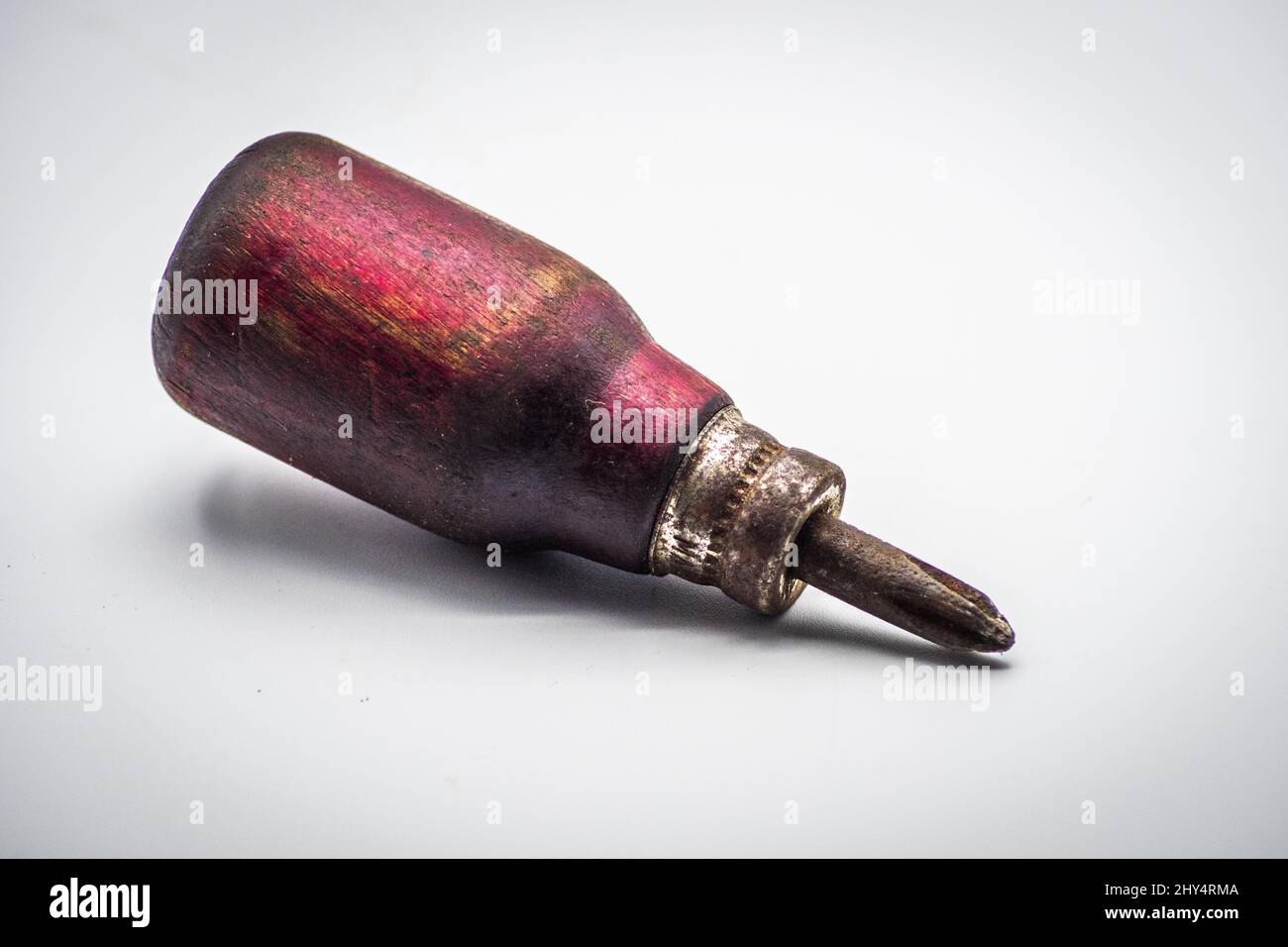 Old stubby red-handle screwdriver insulated on a white background Stock ...