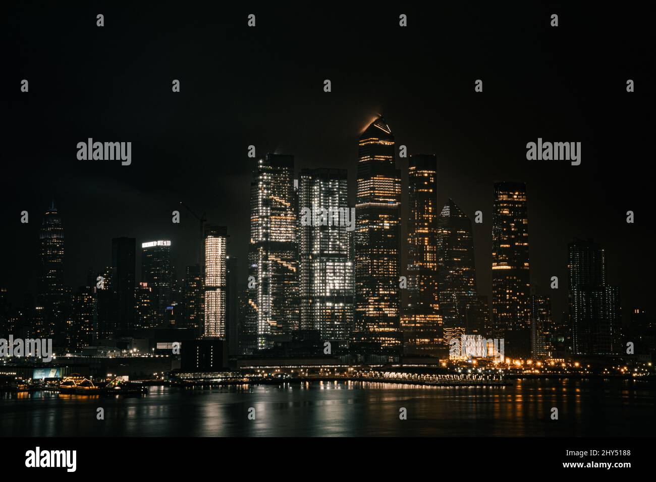 Beautiful night view of the buildings of the city with the river Stock ...