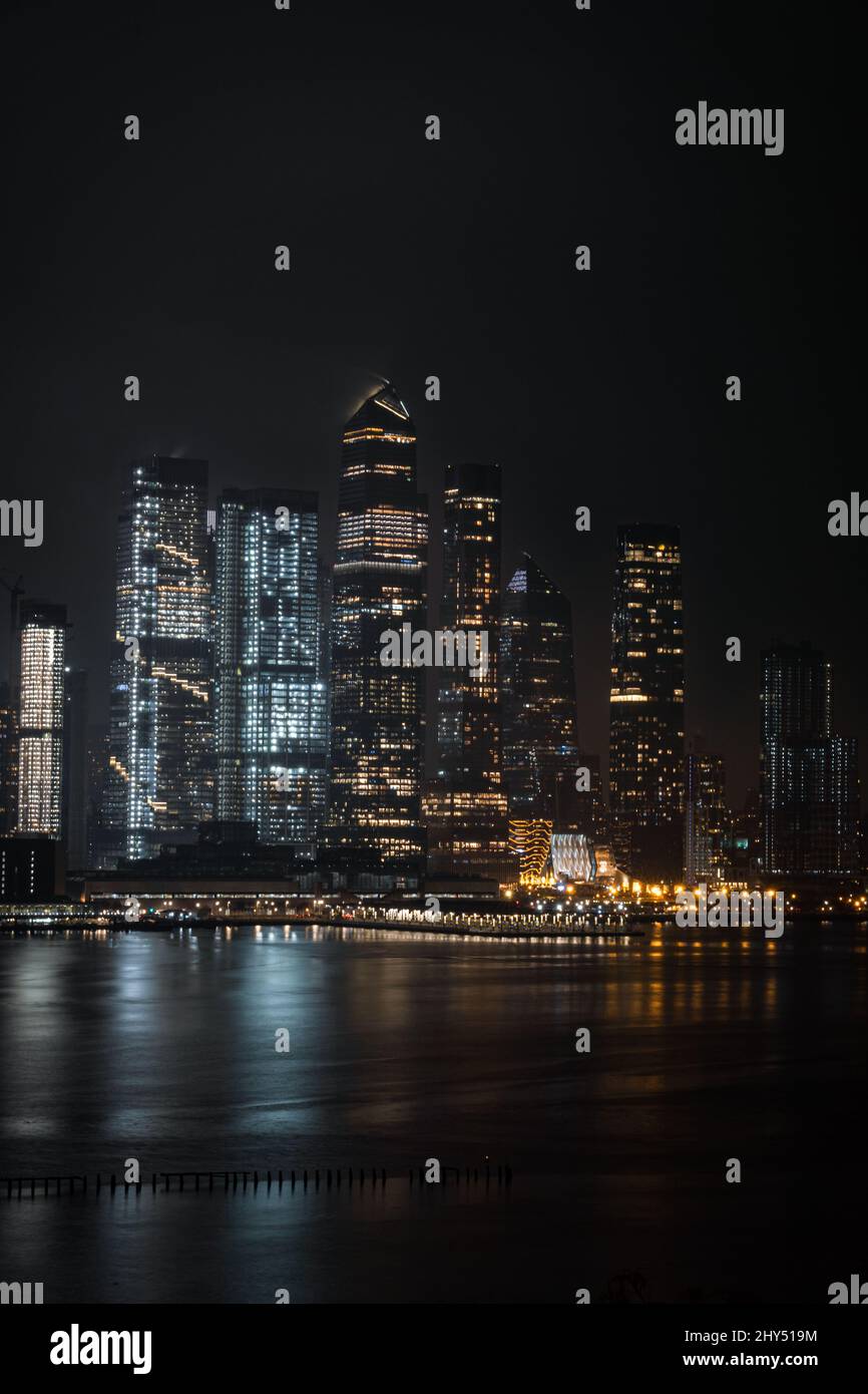 Beautiful night view of the buildings of the city with the river Stock ...