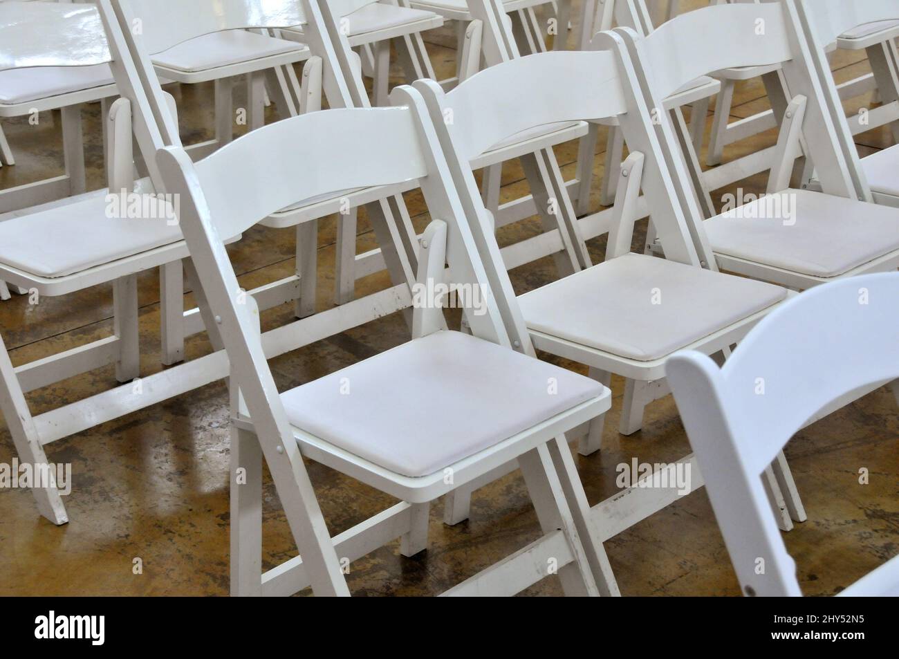 White folding chairs set up at a social event in Missouri Stock Photo ...