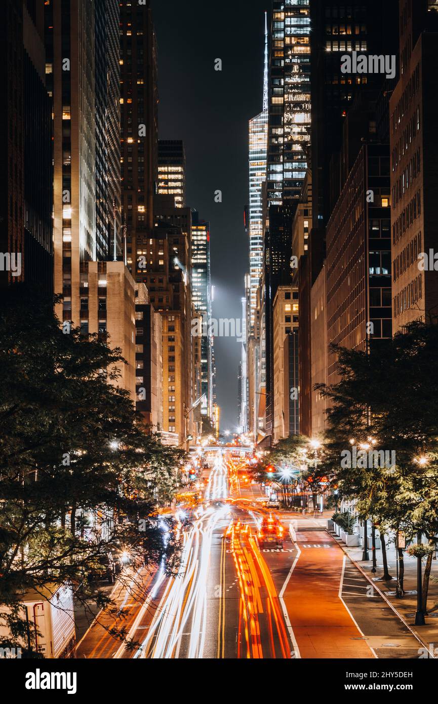 Vertical shot of the cityscape full of skyscrapers and long exposures ...