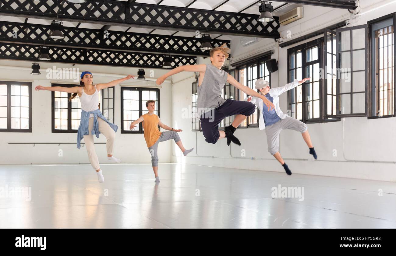 Group of teenagers jumping Stock Photo - Alamy