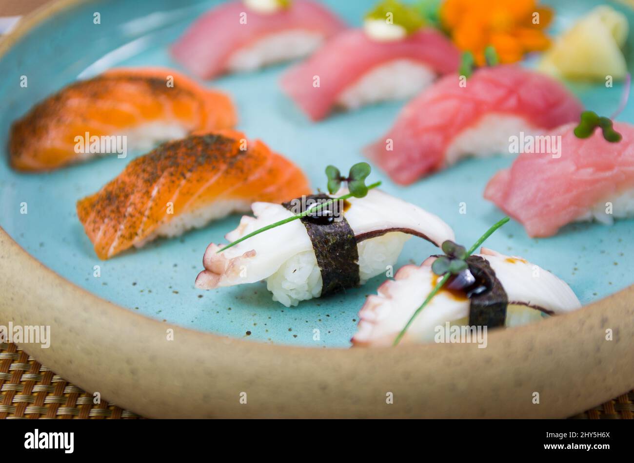 Assorted premium tuna and salmon nigiri sushi on a beautifully ...