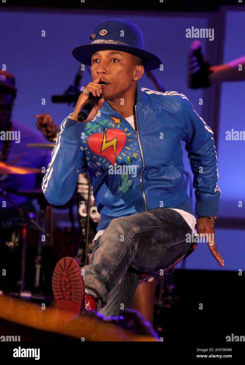 Pharrell Williams performing at the "We Can Survive" benefit concert ...