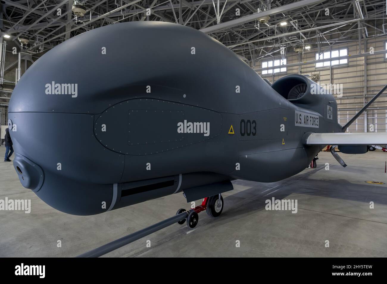 An RQ-4B Global Hawk in a hangar at Misawa Air Base, Japan, March 12 ...