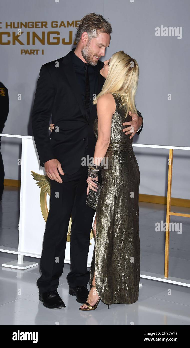 Eric Johnson and Jessica Simpson attending "The Hunger Games ...