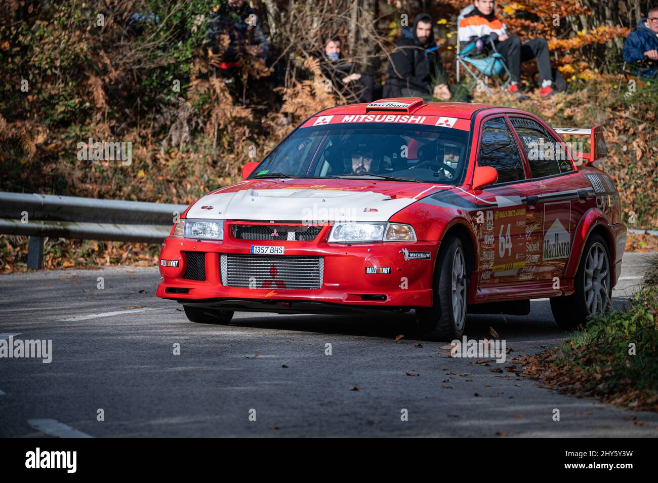 Red Mitsubishi Lancer Evolution VI rally car driving during the 69th ...