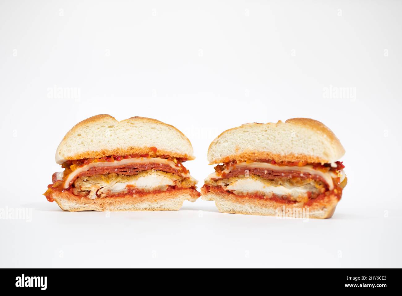 Sandwich cut in half isolated on a white background Stock Photo - Alamy