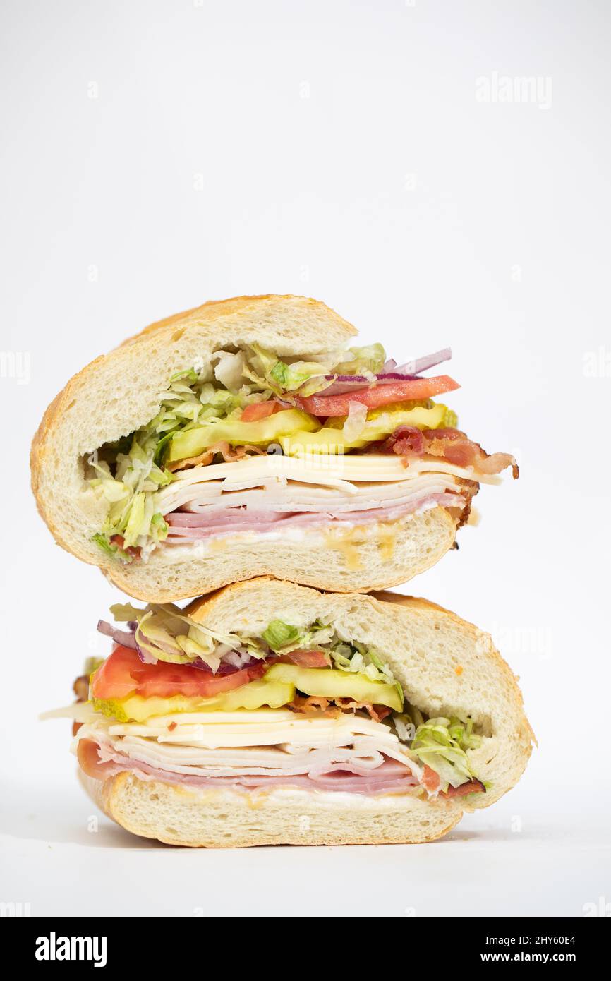 Sandwich cut in half isolated on a white background Stock Photo - Alamy