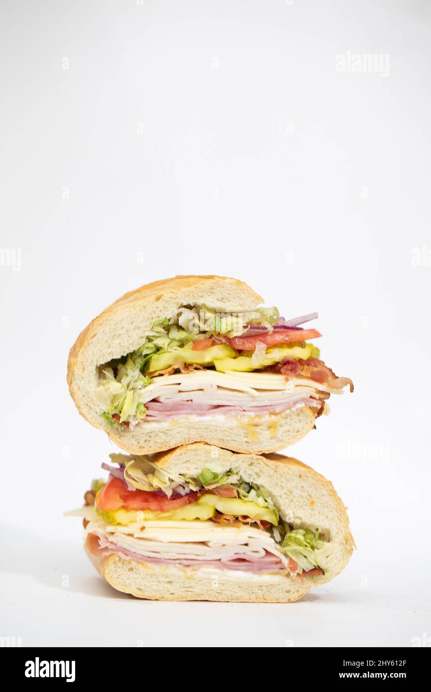 Sandwich cut in half isolated on a white background Stock Photo - Alamy