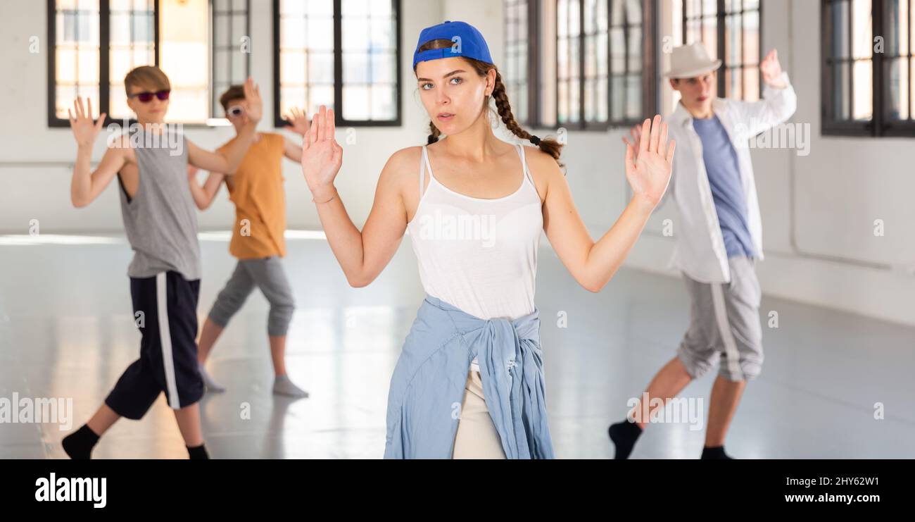 Teenage girl practicing active dance at studio Stock Photo - Alamy