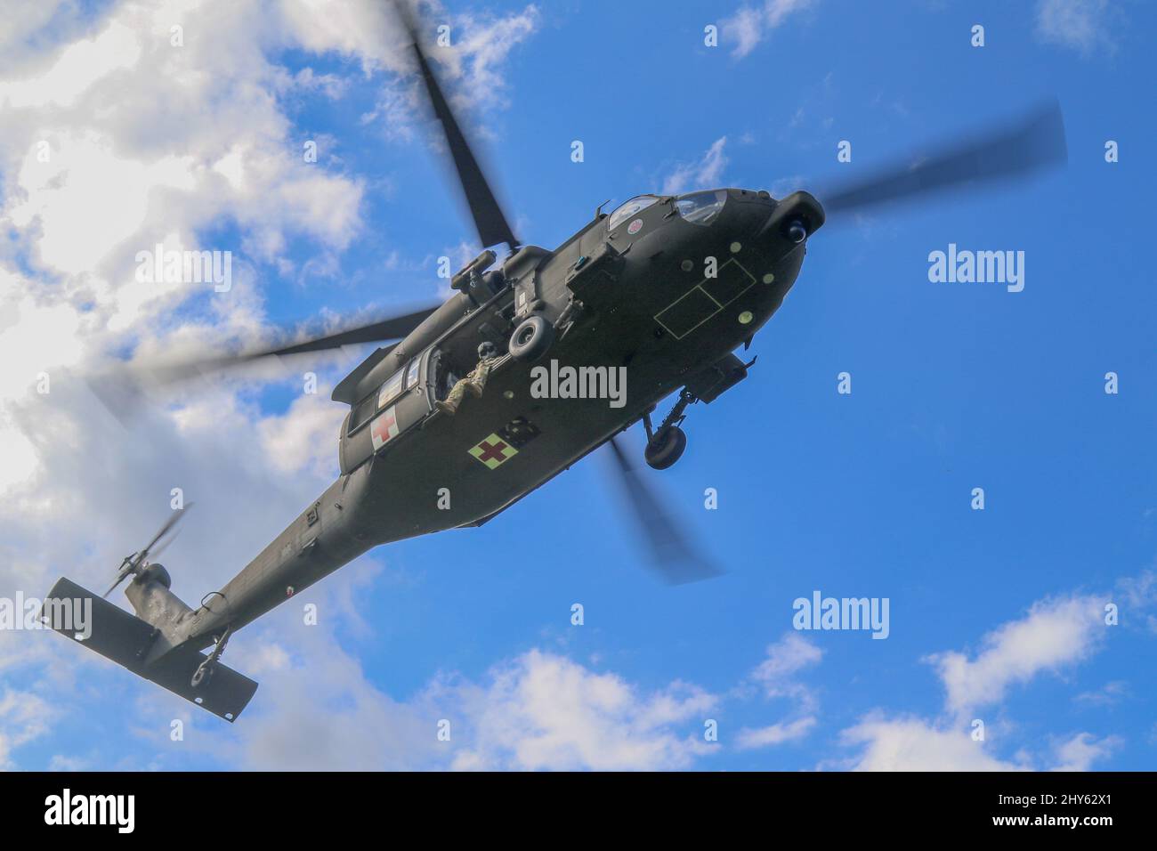 Hawaii Army National Guard (HIARNG) Soldier, Sgt. Brant Tsuda, a UH-60 ...
