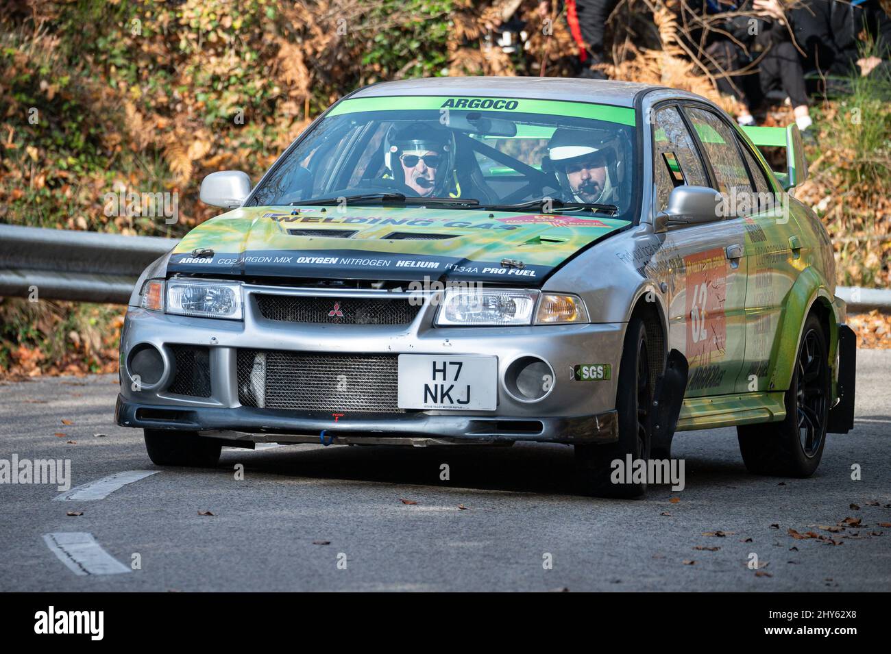 Green Mitsubishi Lancer Evolution VI rally car driving during the 69th ...