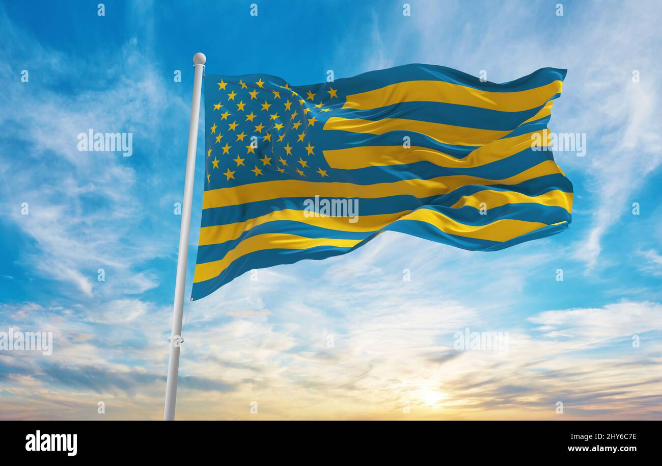 flags of USA in colors of Ukrainian flag waving in sky. panoramic view ...