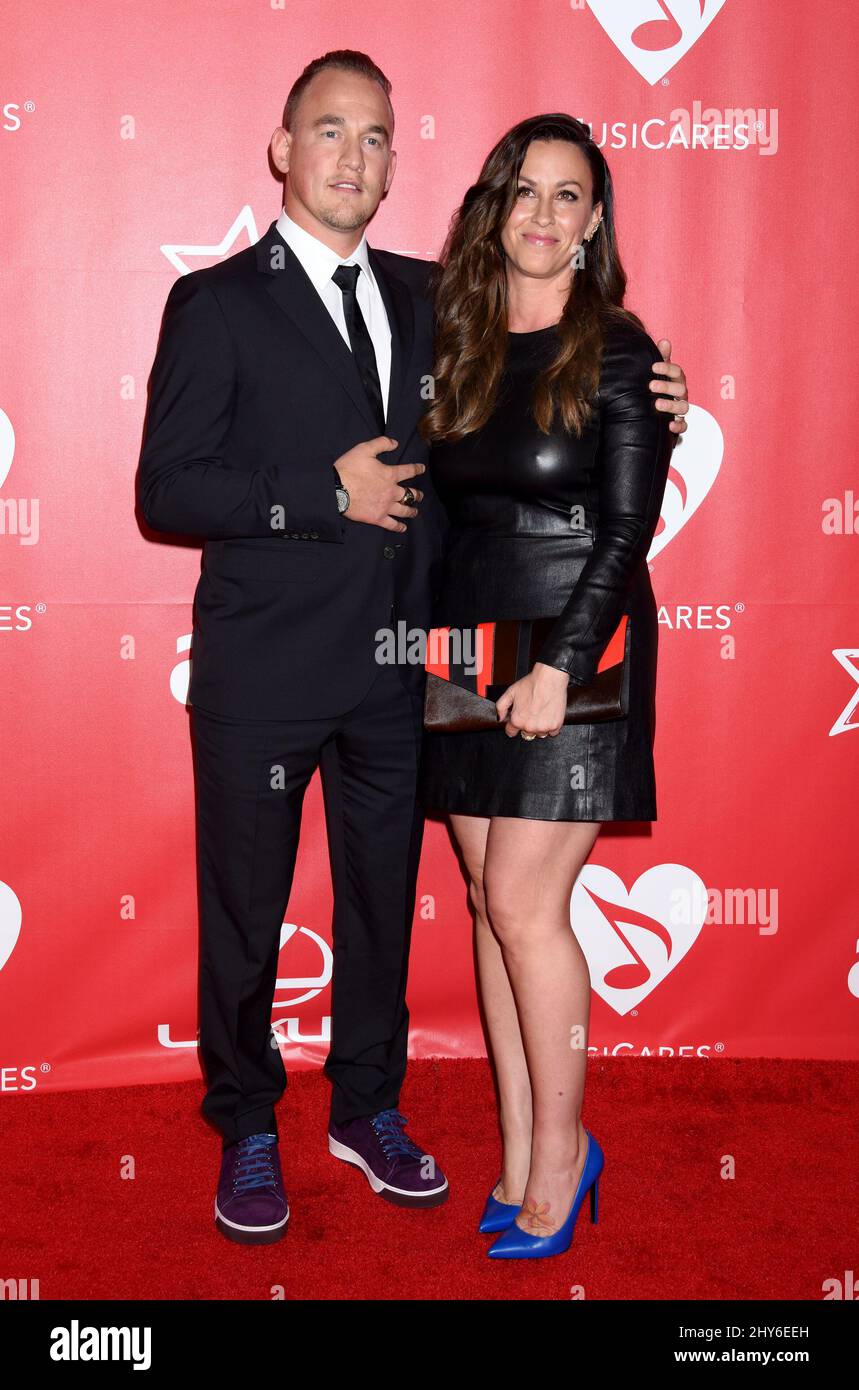 Alanis Morissette and Mario Treadway attending the 2015 MusiCares ...
