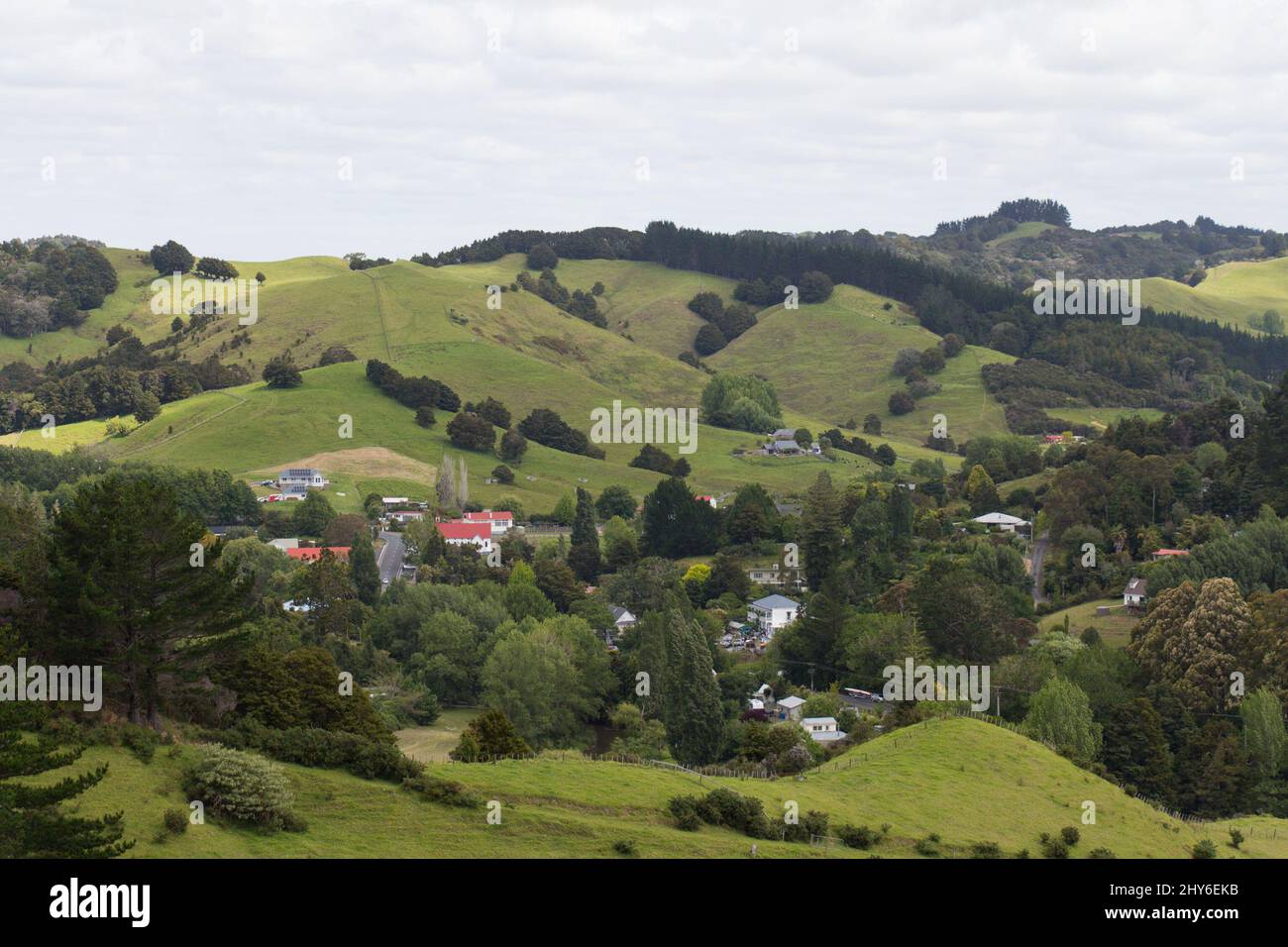 The view of countryside landscape with green hills, forest and village ...