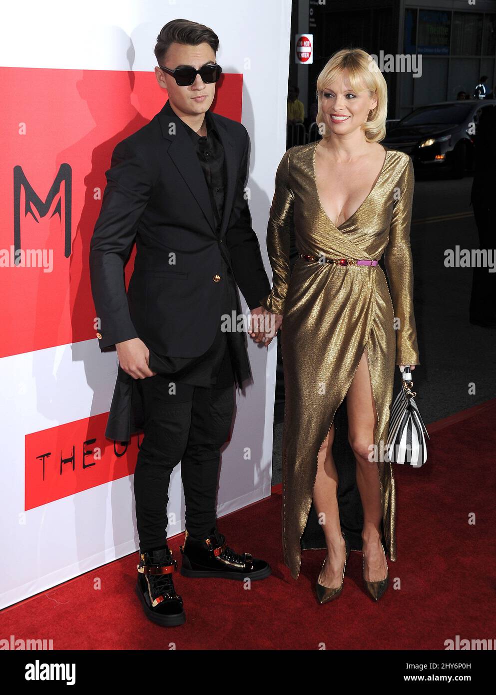 Pamela Anderson, Brandon Thomas Lee attending "The Gunman" Los Angeles ...