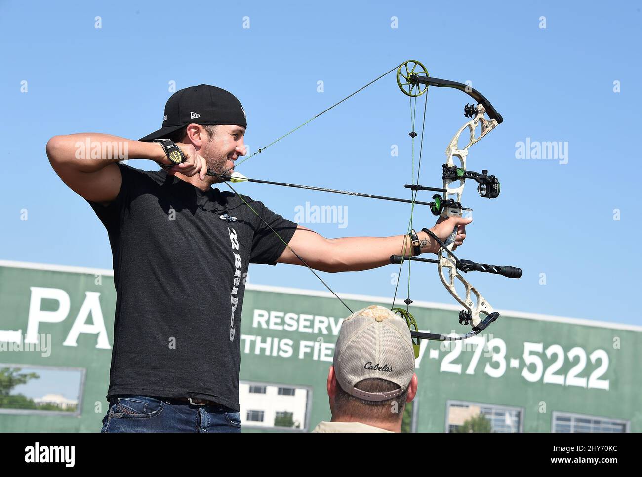 Luke Bryan Shooting A Bow