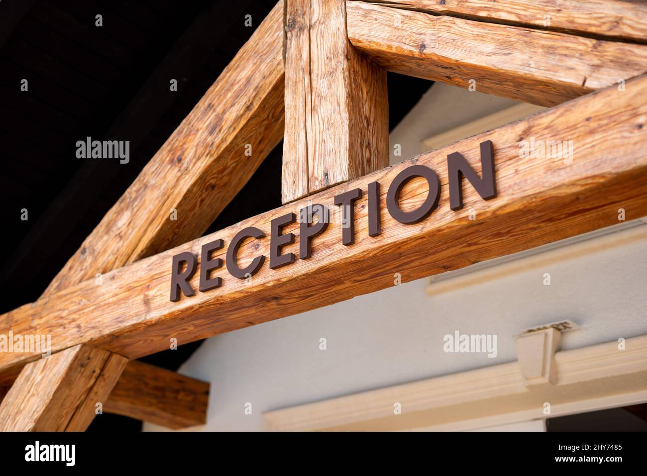 Low angle shot of a reception sign on a wooden roof structure Stock ...