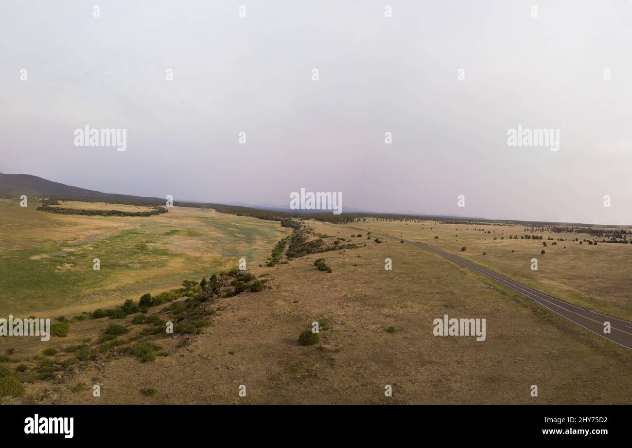 Road passing through smooth green field, Arizona, USA Stock Photo - Alamy