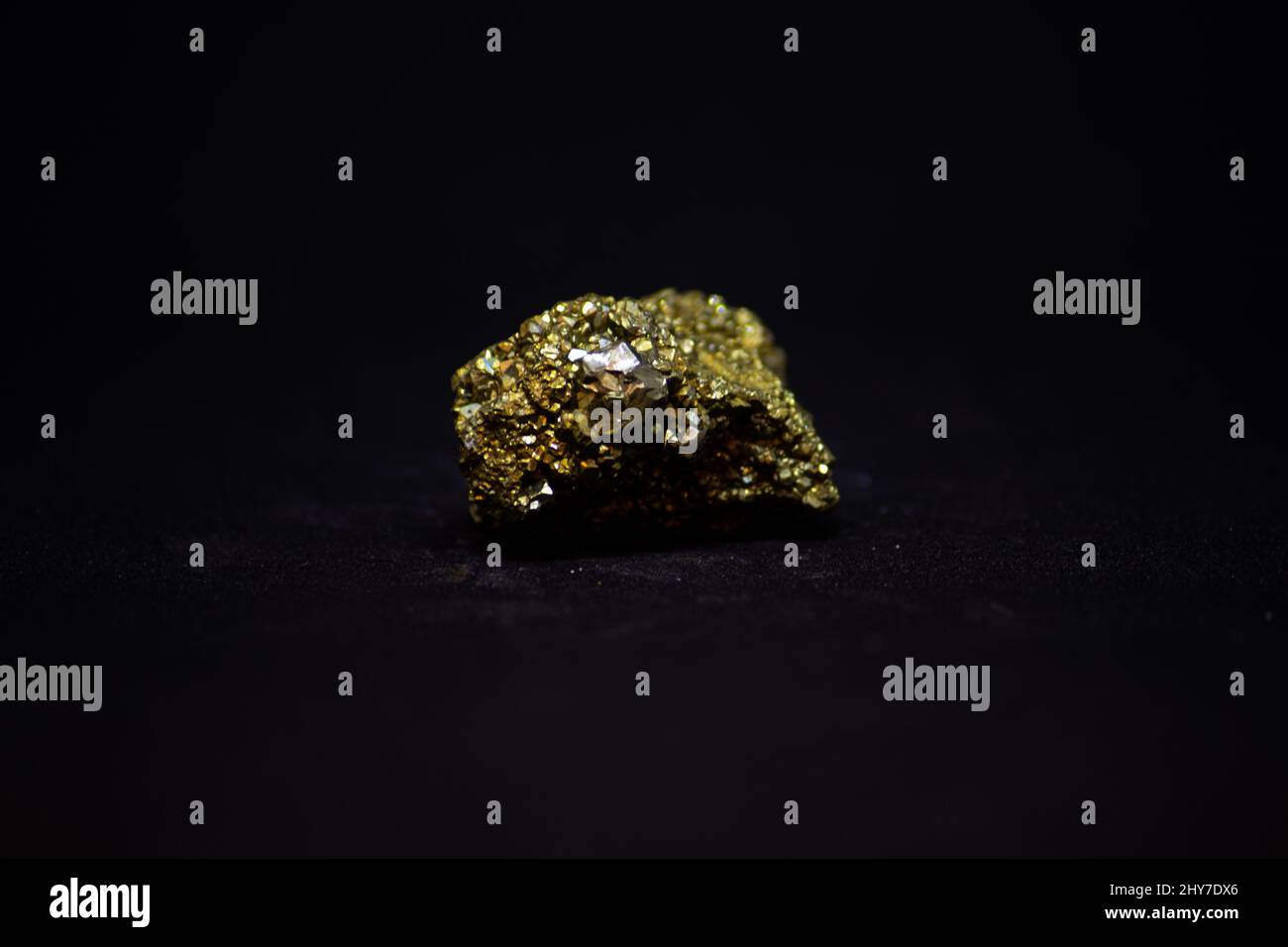 Photo of a small expensive mineral on a black background Stock Photo ...