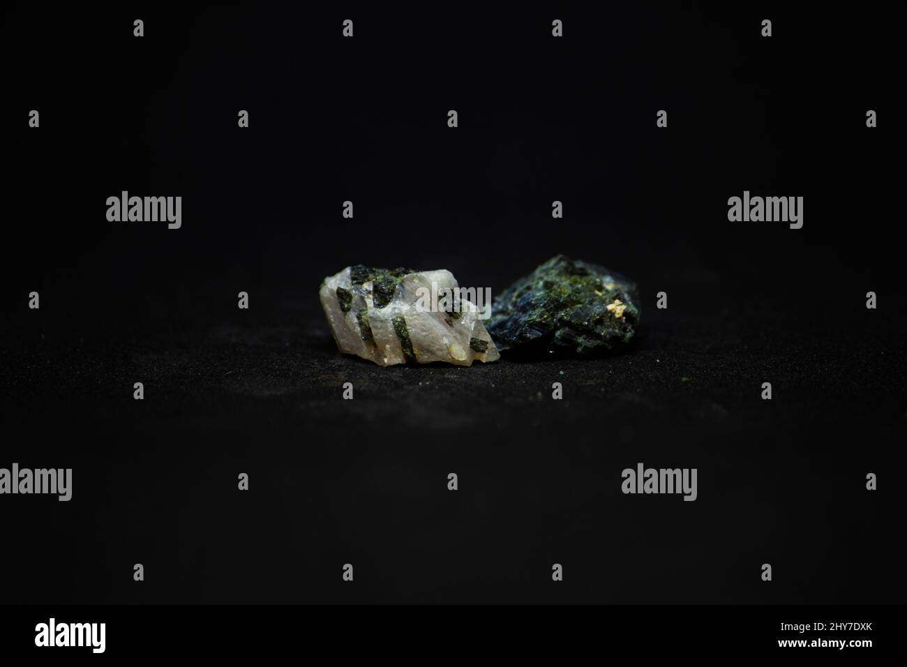 Photo of a small expensive mineral on a black background Stock Photo ...