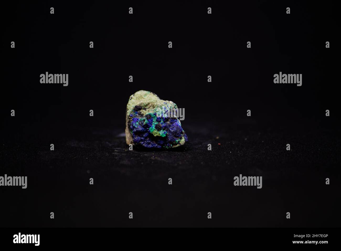Shot of a small expensive mineral on a black background Stock Photo - Alamy