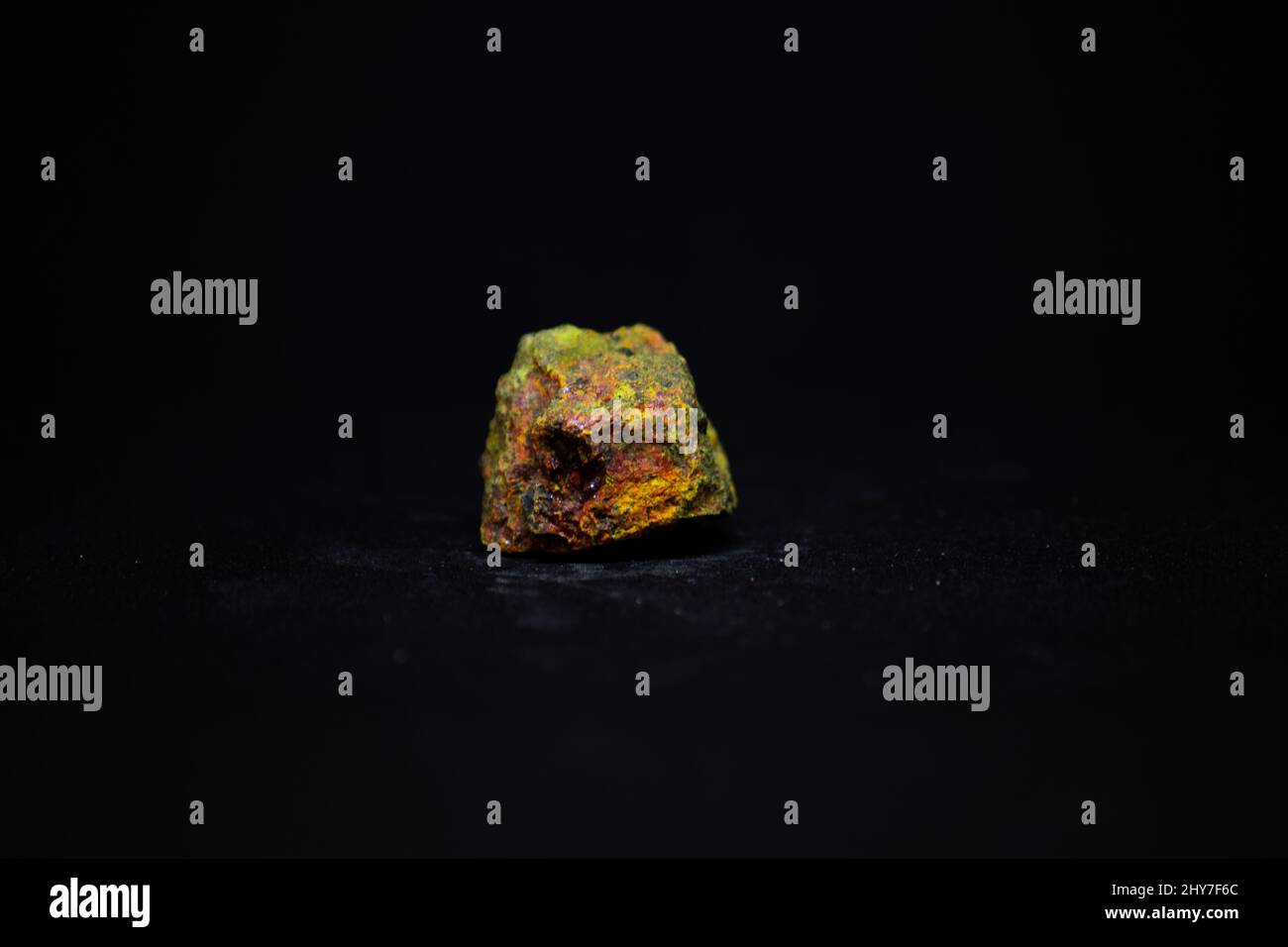 Shot of a small expensive mineral on a black background Stock Photo - Alamy