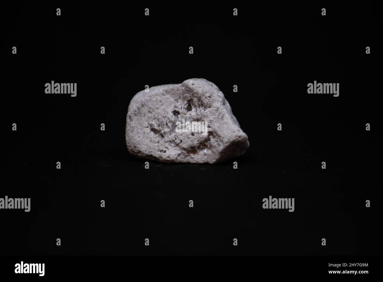 Closeup of a pumice mineral on black background Stock Photo - Alamy