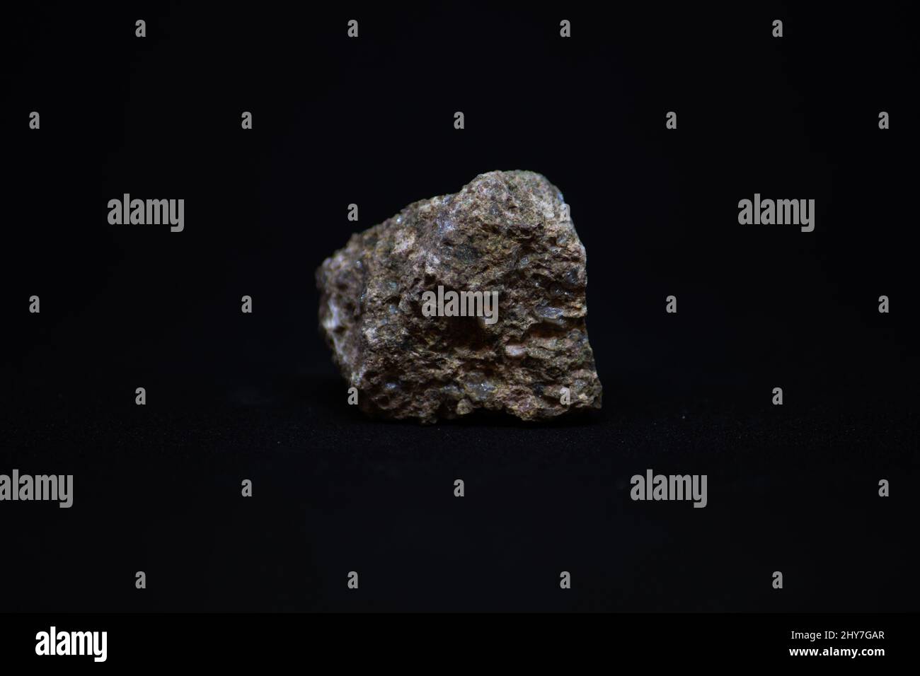 Closeup of a porphyry mineral on black background Stock Photo - Alamy